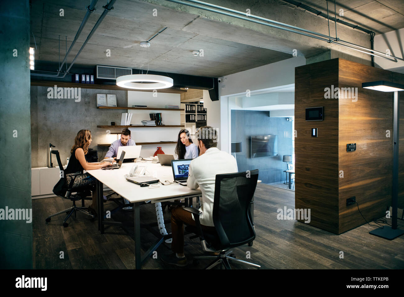 business people using laptops while working in office Stock Photo - Alamy