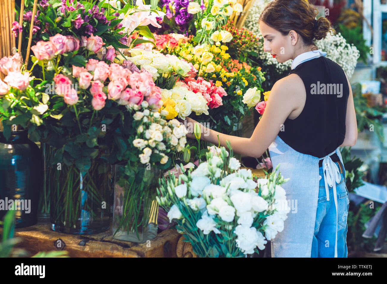 Woman Picking At Leaves Of Flower High Resolution Stock Photography and ...