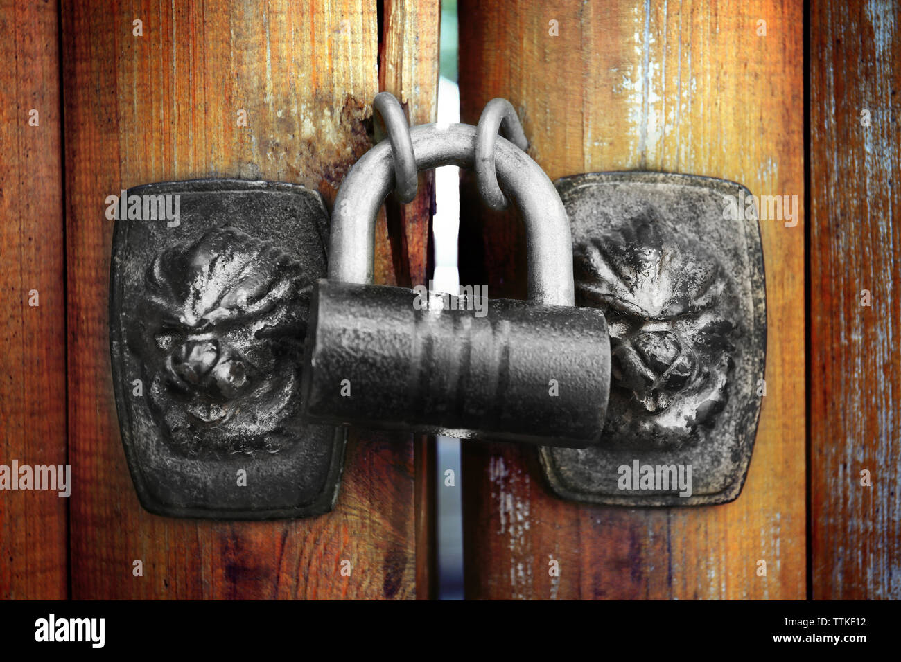 Lock hanging on the old door Stock Photo - Alamy