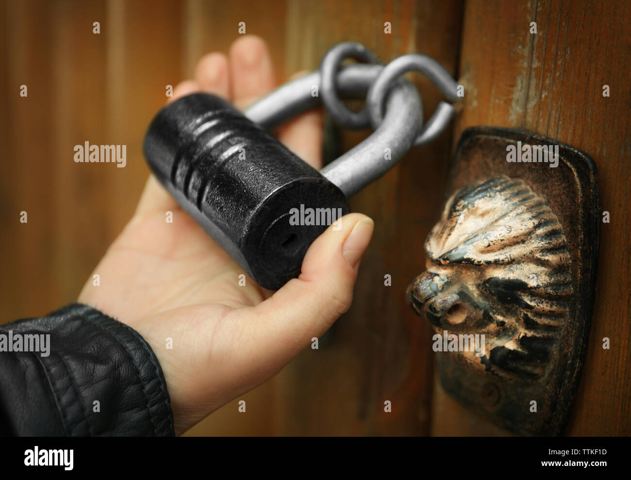 Female hand holding old lock Stock Photo - Alamy