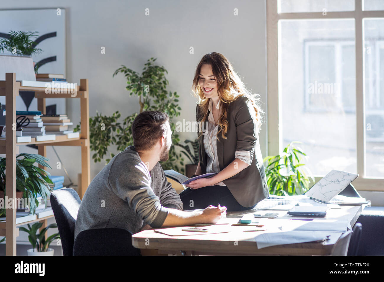 Two students talking classroom hi-res stock photography and images - Alamy