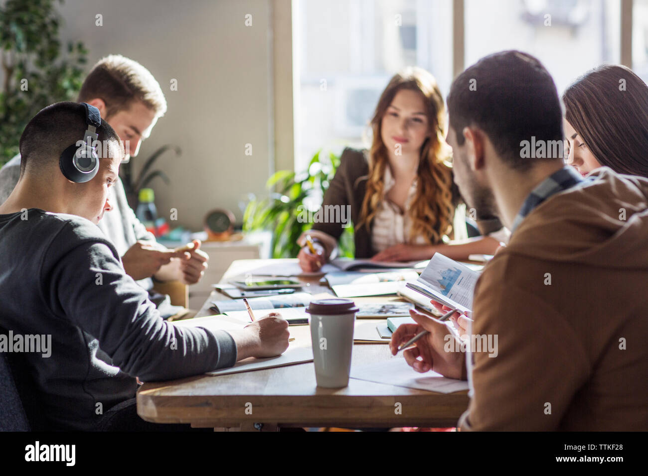 Young adults studying together in hi-res stock photography and images ...