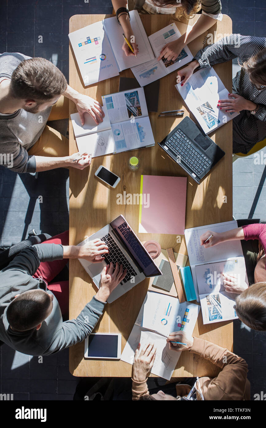 Group college students sitting table hi-res stock photography and ...