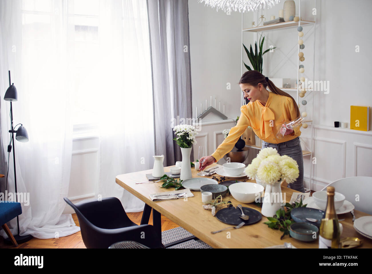 Woman arranging at home hi-res stock photography and images - Alamy