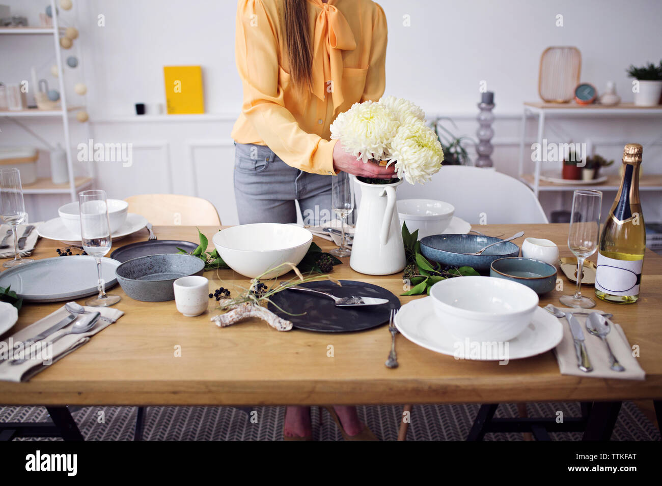 Woman arranging flowers in her home hi-res stock photography and images ...