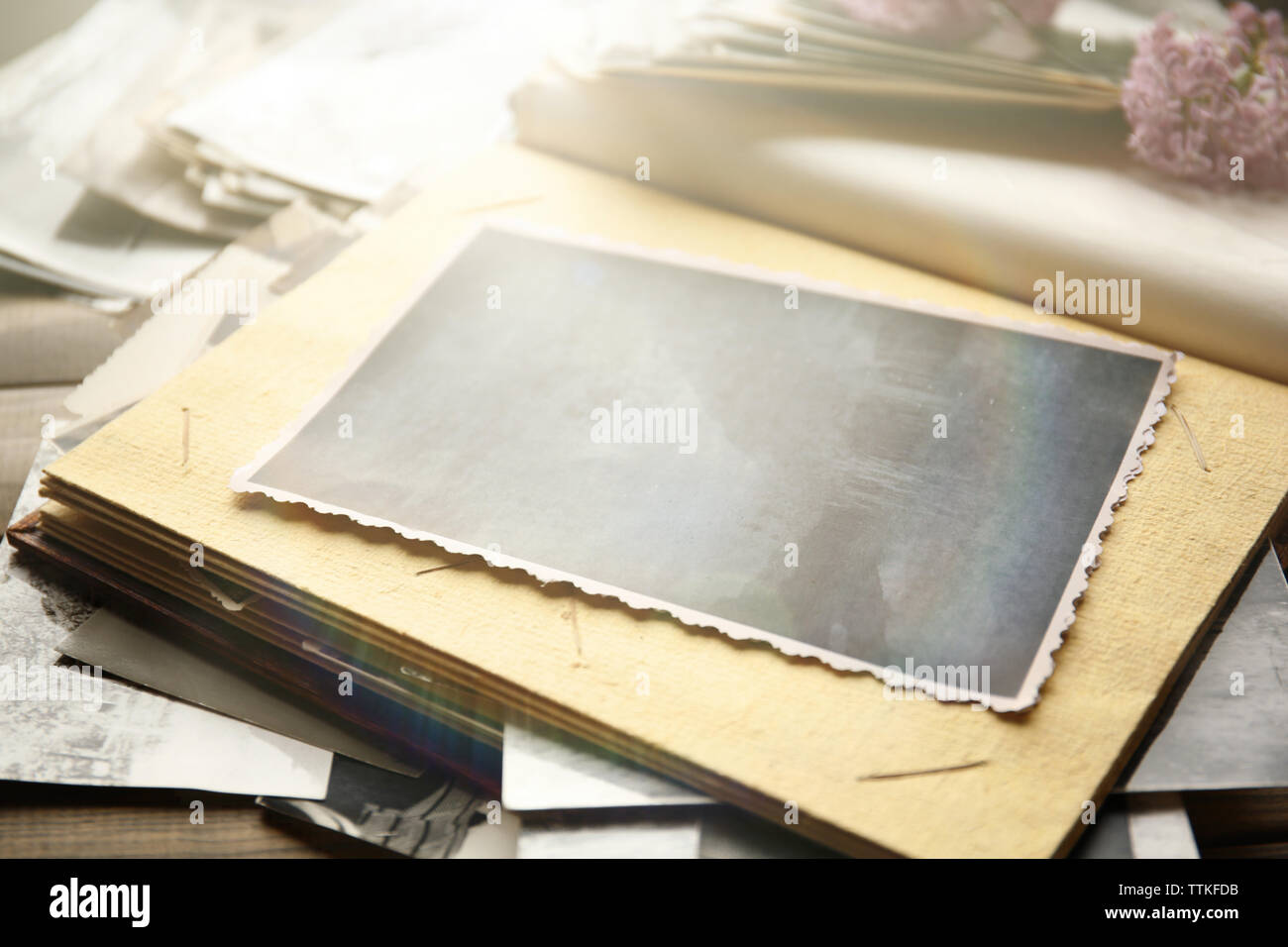 Vintage photos with camera on wooden background Stock Photo - Alamy