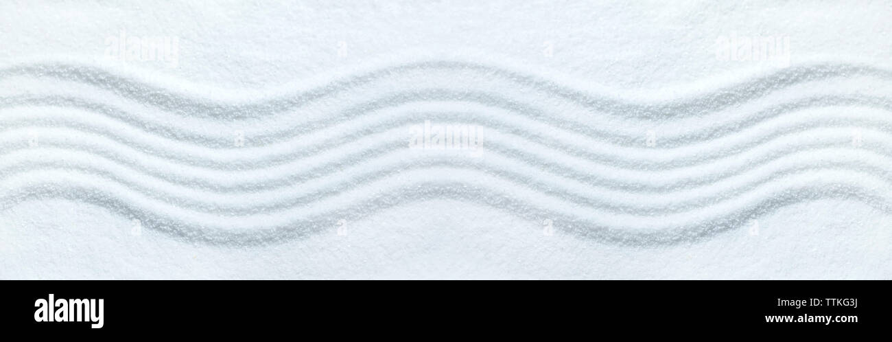 Zen wave pattern in white sand Stock Photo - Alamy