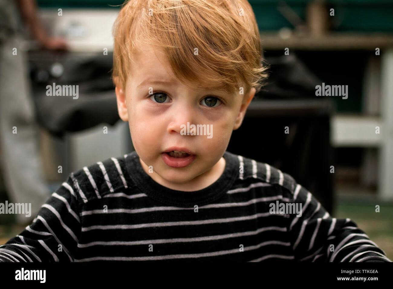 Close-up portrait of cute surprised boy at backyard Stock Photo - Alamy