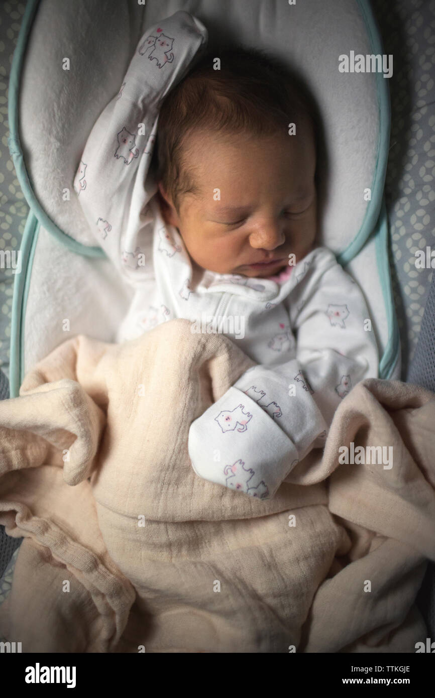 Baby girl sleeping in crib hi-res stock photography and images - Alamy