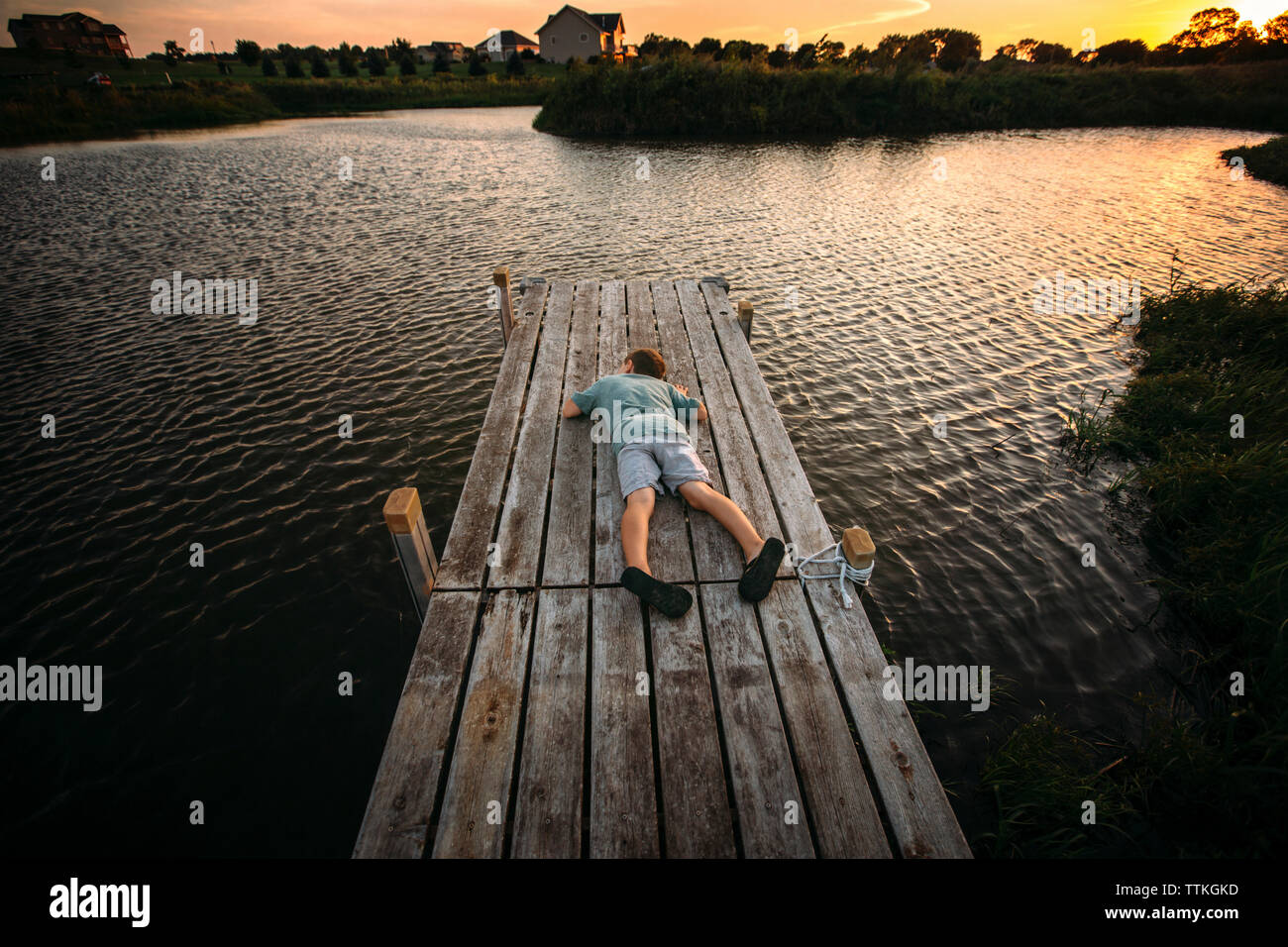 Boy lying down hi-res stock photography and images - Alamy