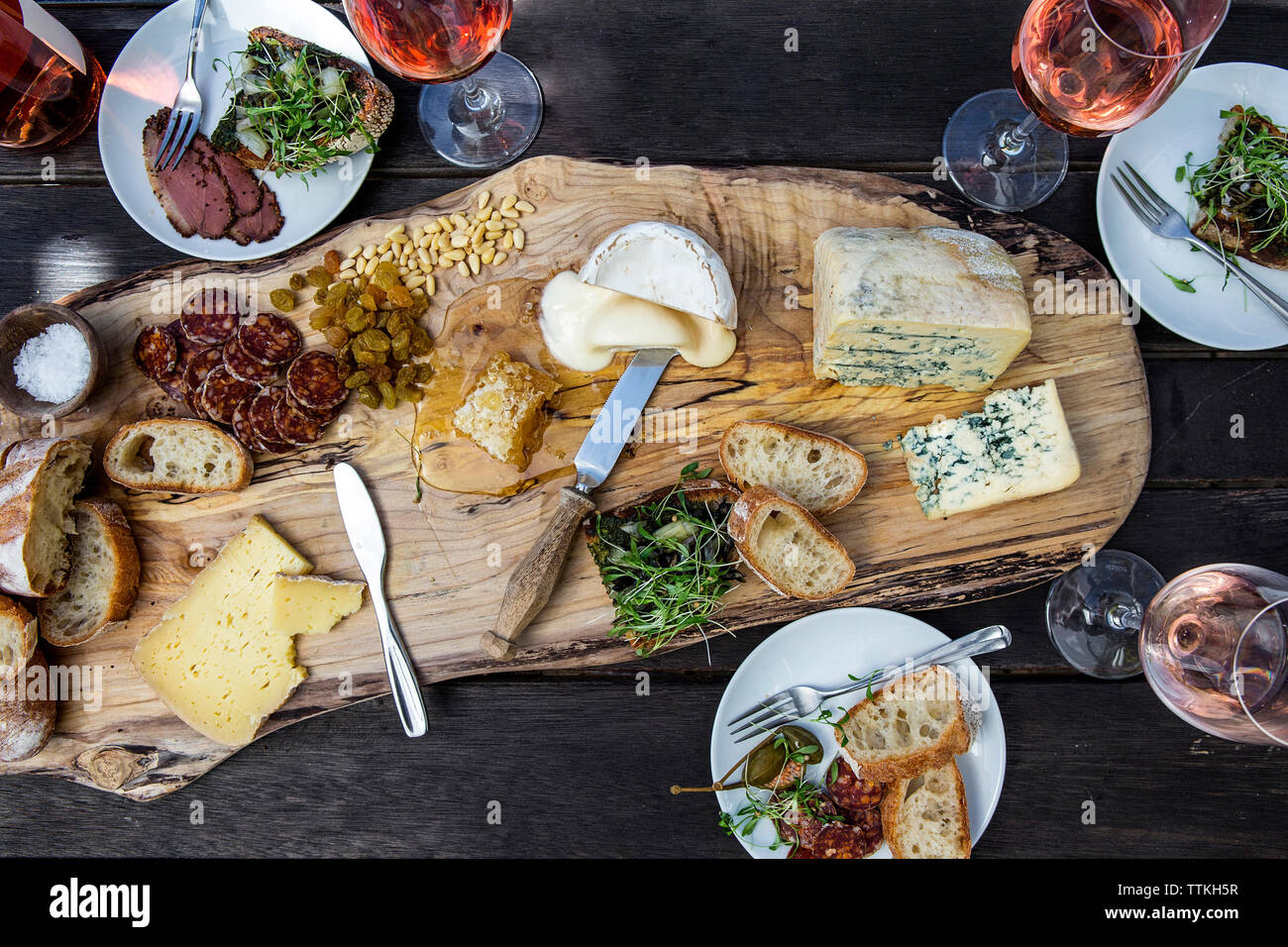 High angle view of various food with wine served on wooden table Stock ...