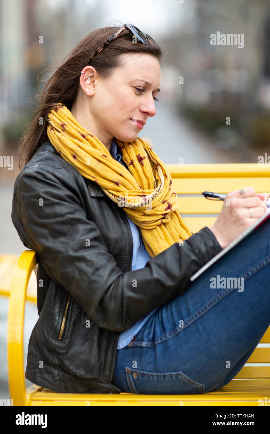 Side view woman writing hi-res stock photography and images - Alamy