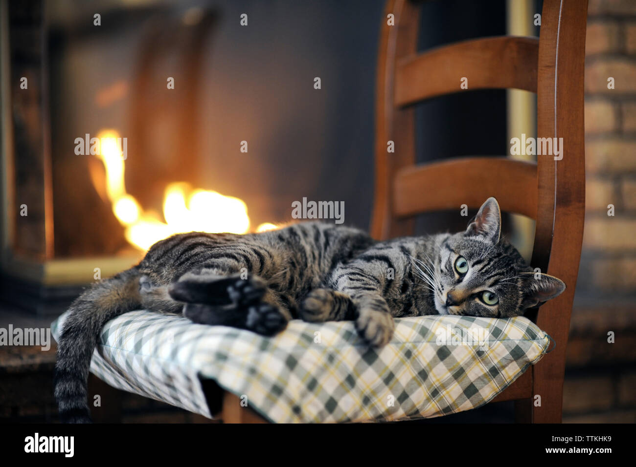 Chair by fireplace hi-res stock photography and images - Alamy
