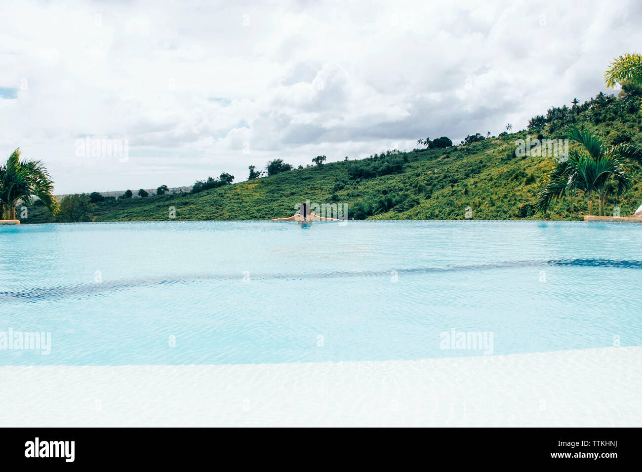 Rear view young woman swimming pool hi-res stock photography and images ...
