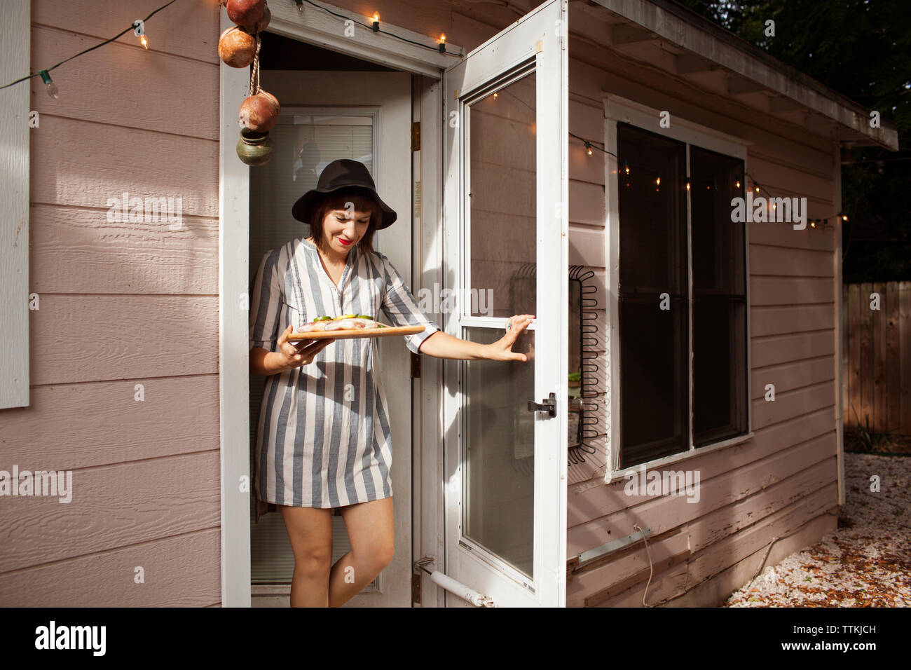 Female bringing food to young hi-res stock photography and images - Alamy