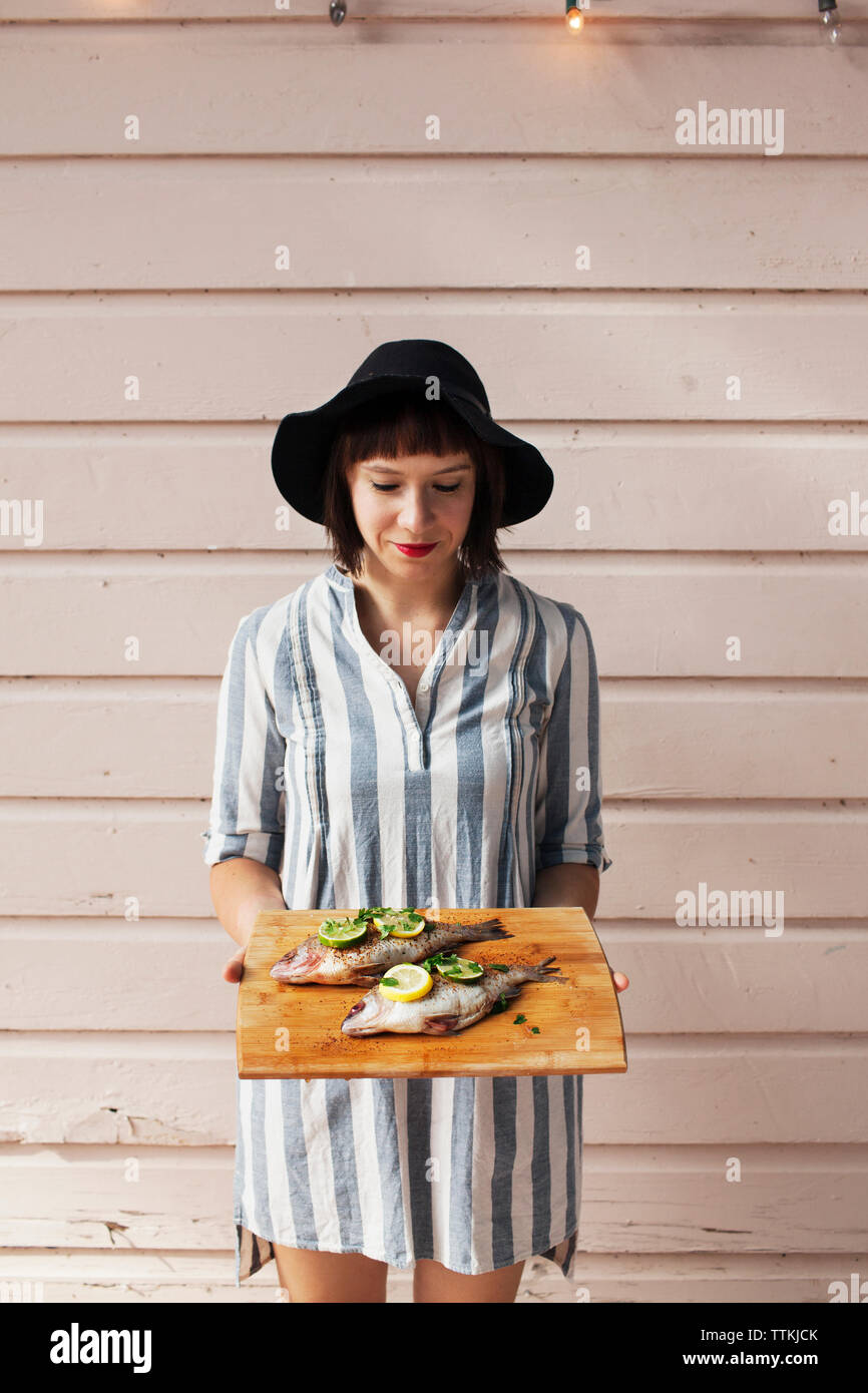 Woman holding fish hi-res stock photography and images - Alamy