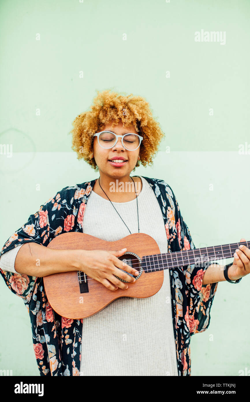 Strumming guitar hi-res stock photography and images - Alamy