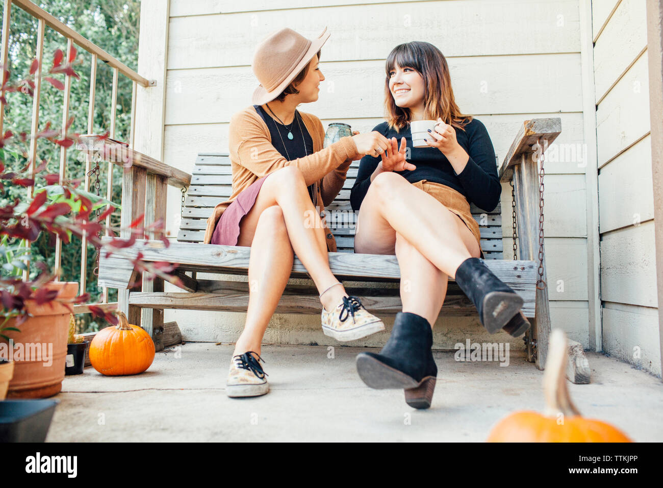 Friends talking on porch hi-res stock photography and images - Alamy