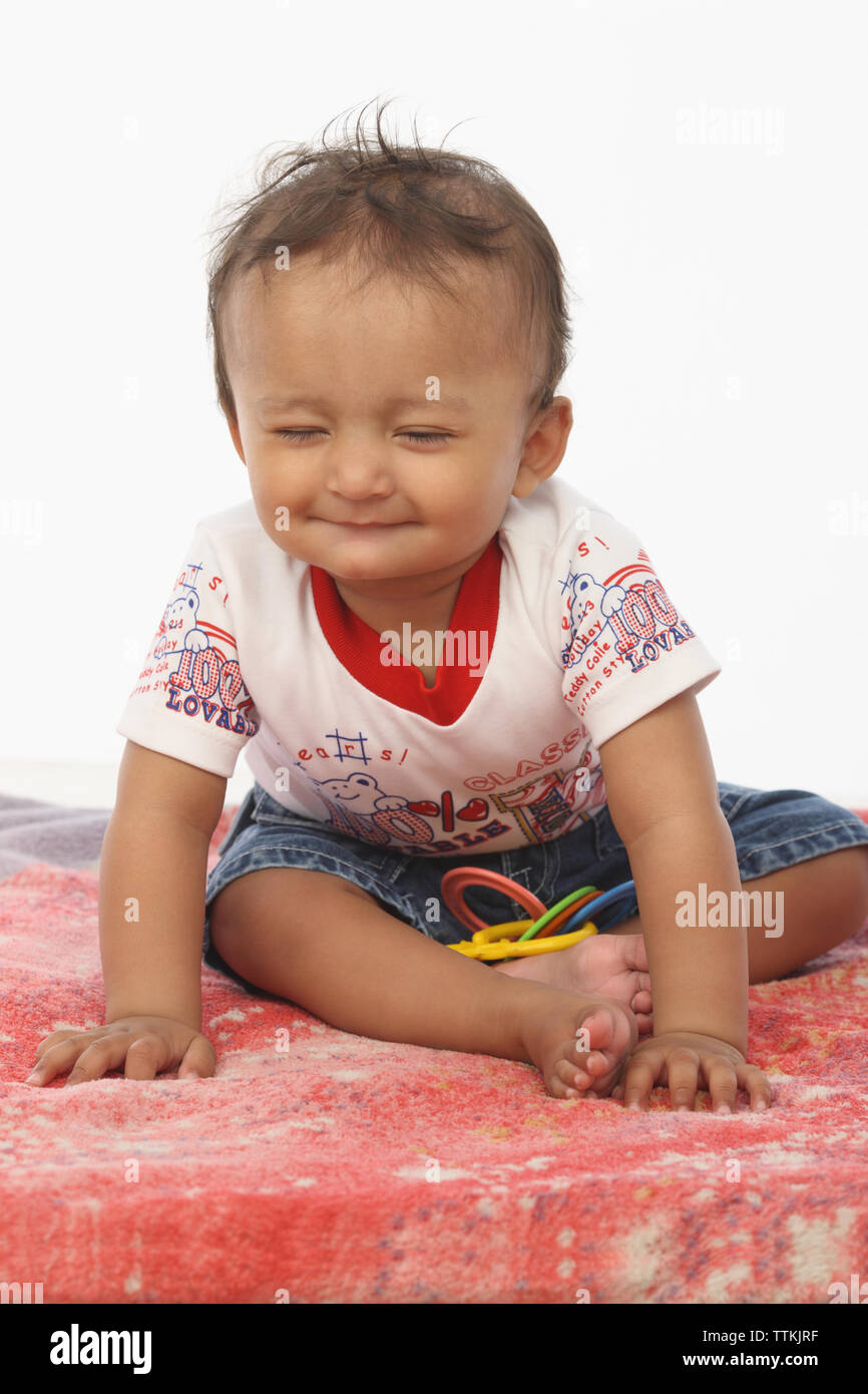 Baby boy with eyes closed Stock Photo - Alamy
