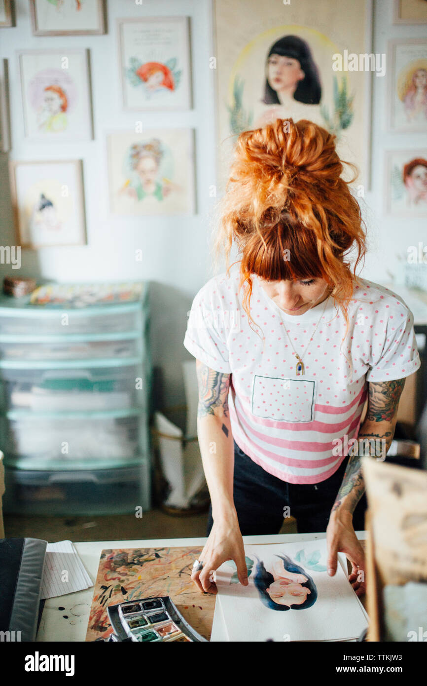 Female artist working in studio Stock Photo - Alamy