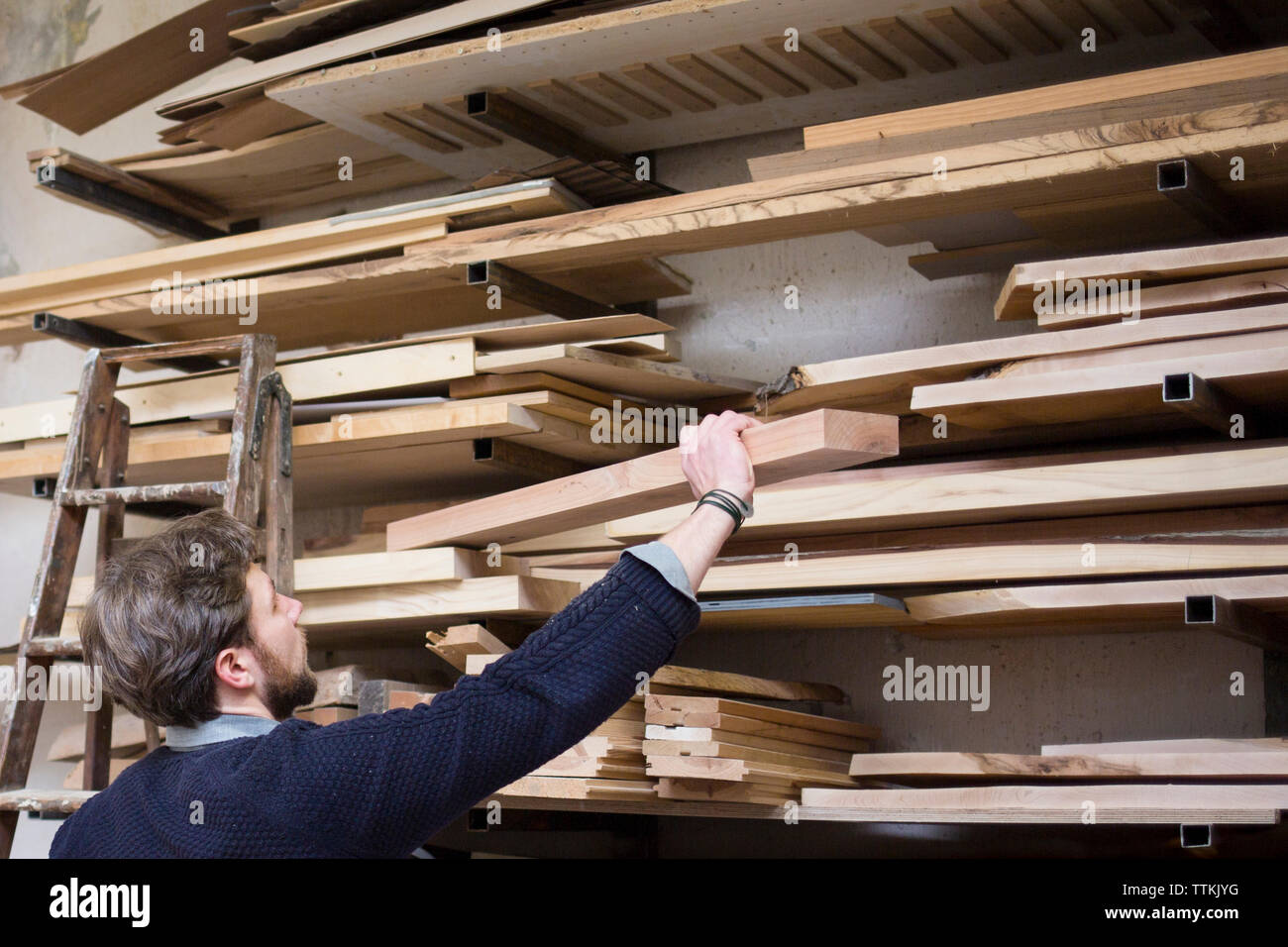 Rear view male worker working hi-res stock photography and images - Alamy
