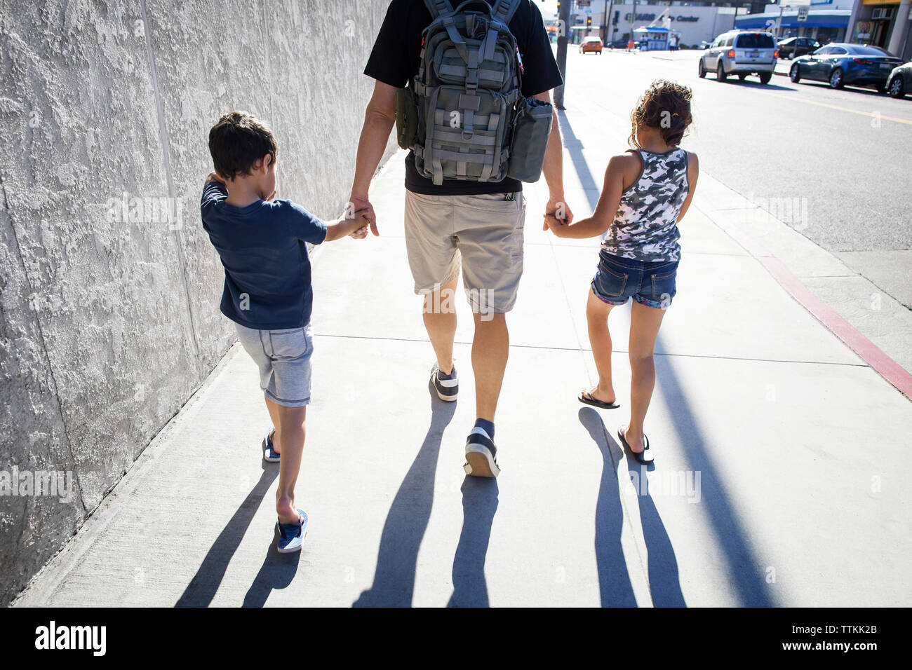 Children walking sidewalk hi-res stock photography and images - Alamy