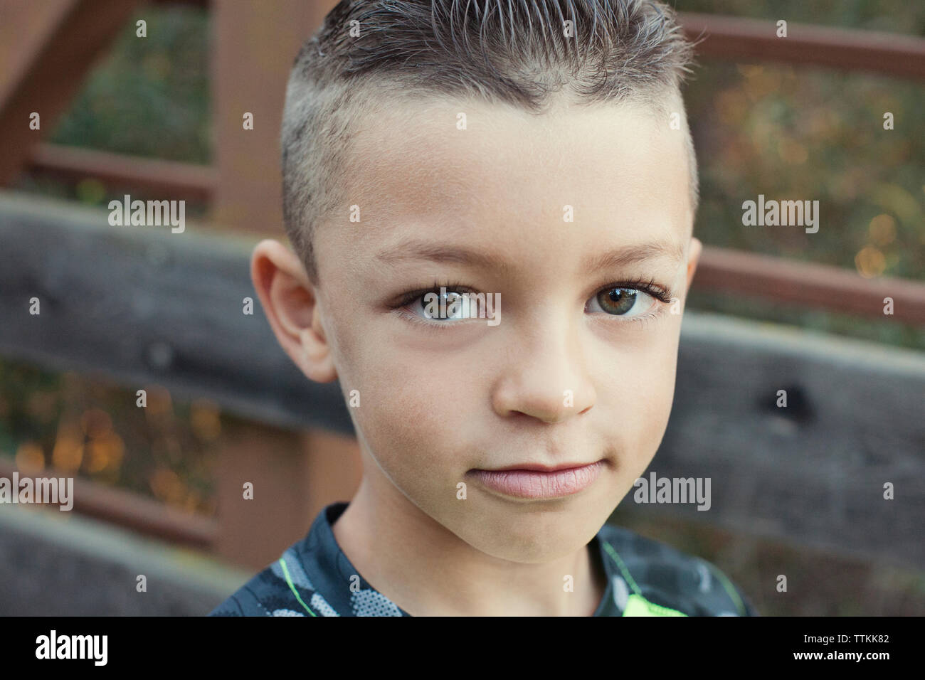 Boy standing looking at camera hi-res stock photography and images - Alamy