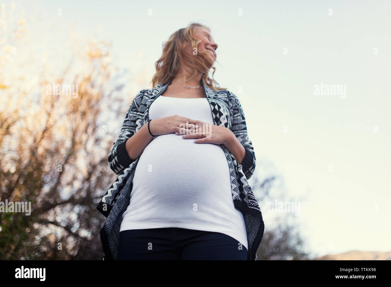 Woman smile pregnant abdomen hi-res stock photography and images - Alamy