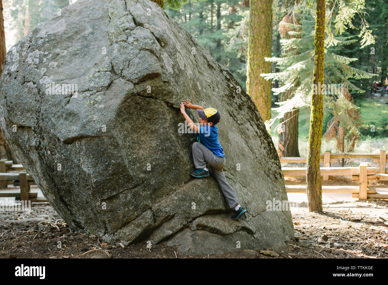 Boy climbing rock hi-res stock photography and images - Alamy