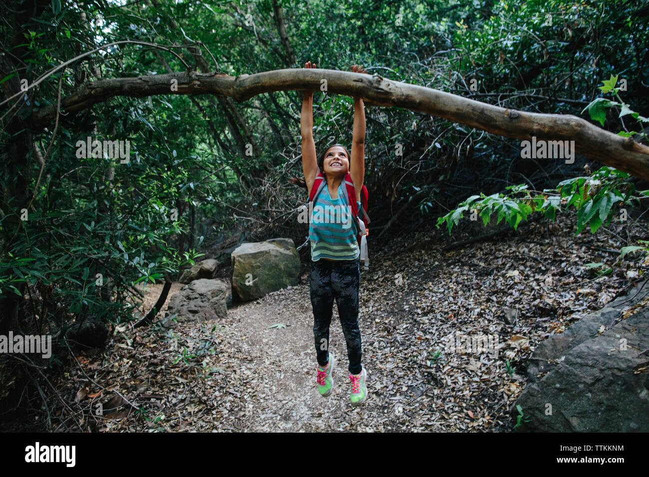Girl hanging tree hi-res stock photography and images - Alamy