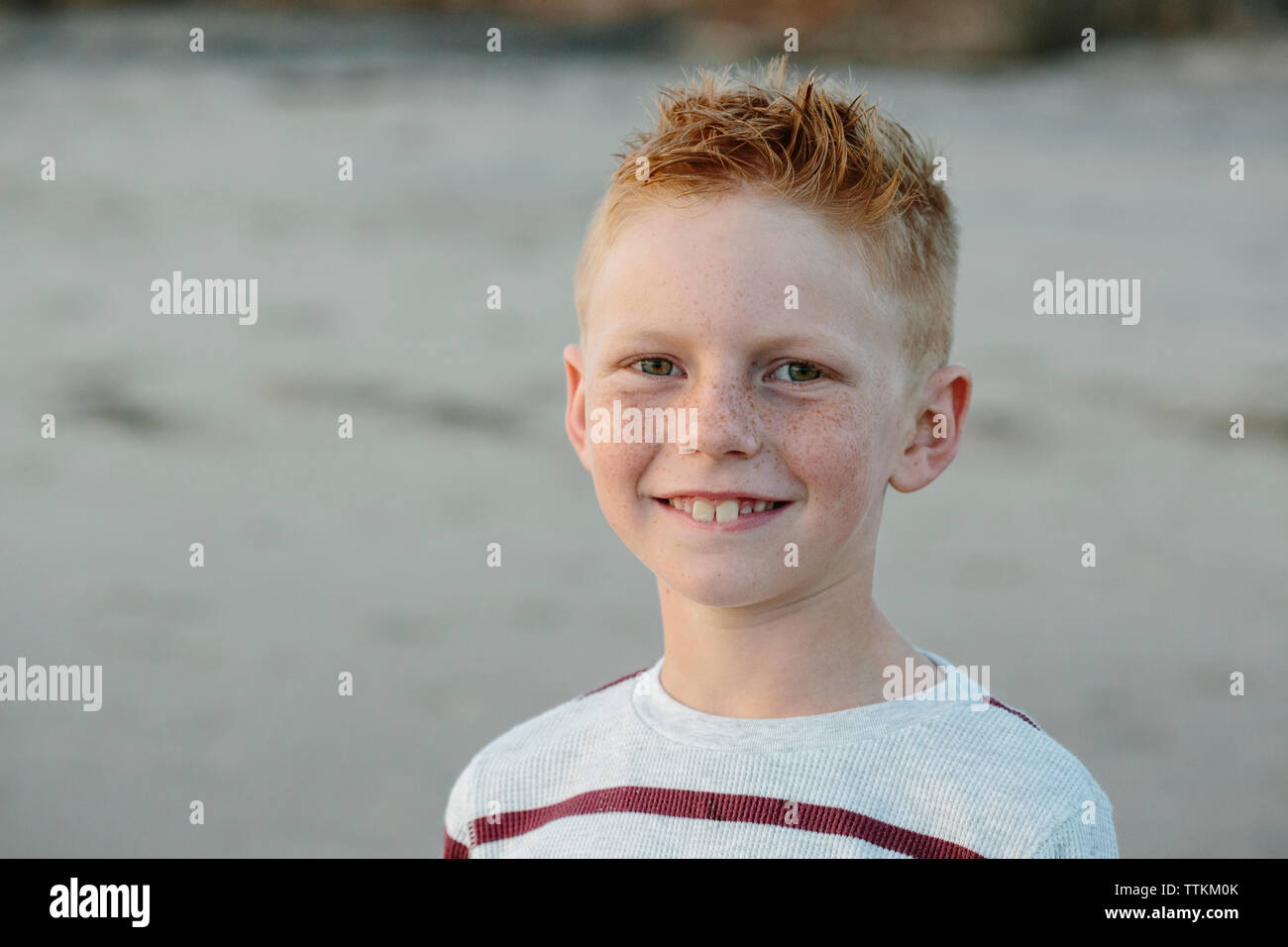 Portrait of smiling boy with freckles at beach Stock Photo - Alamy