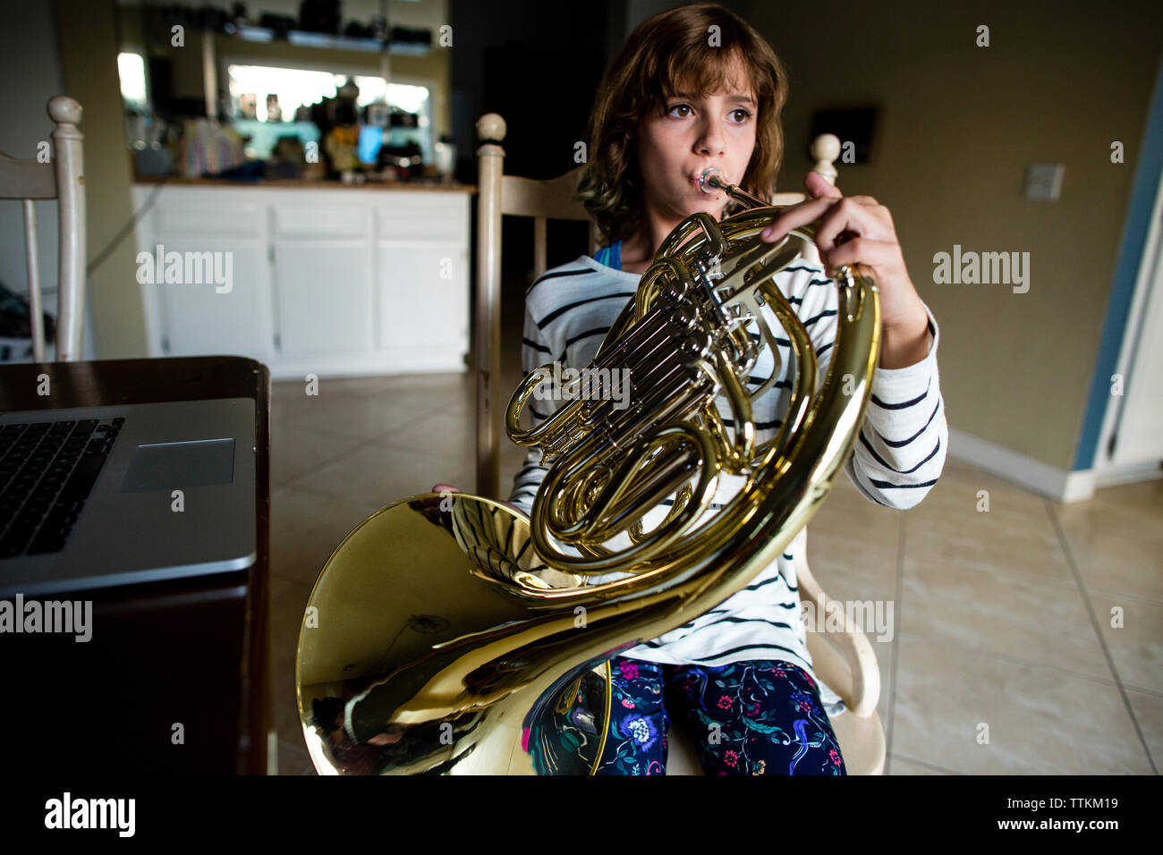 French Horn Player Sitting