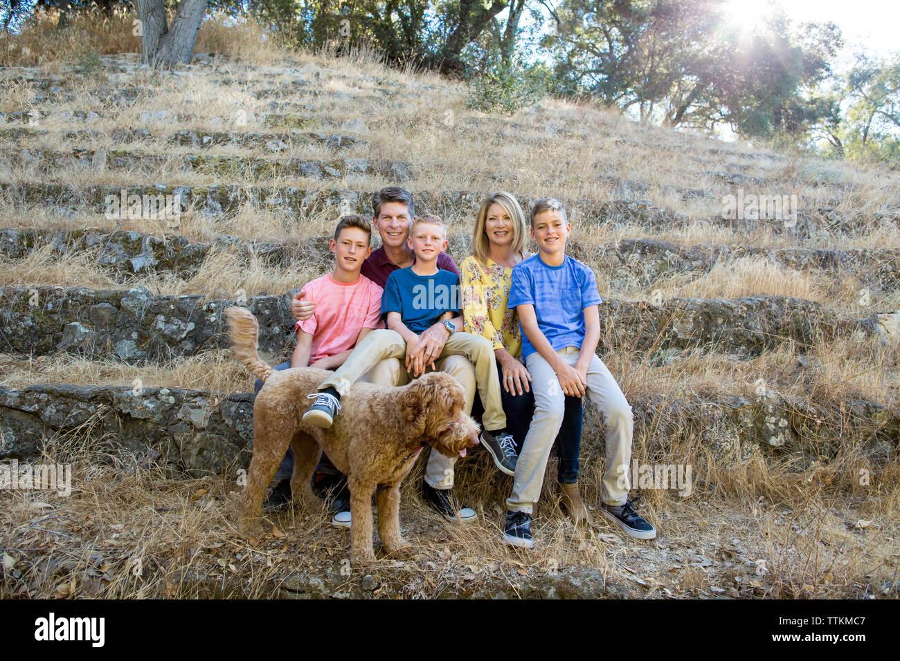 Family of 5 with labradoodle pose for a portrait in nature Stock Photo ...