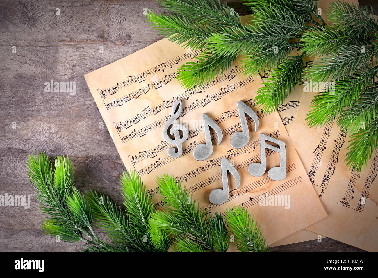 Music notes and Christmas tree on wooden background Stock Photo - Alamy