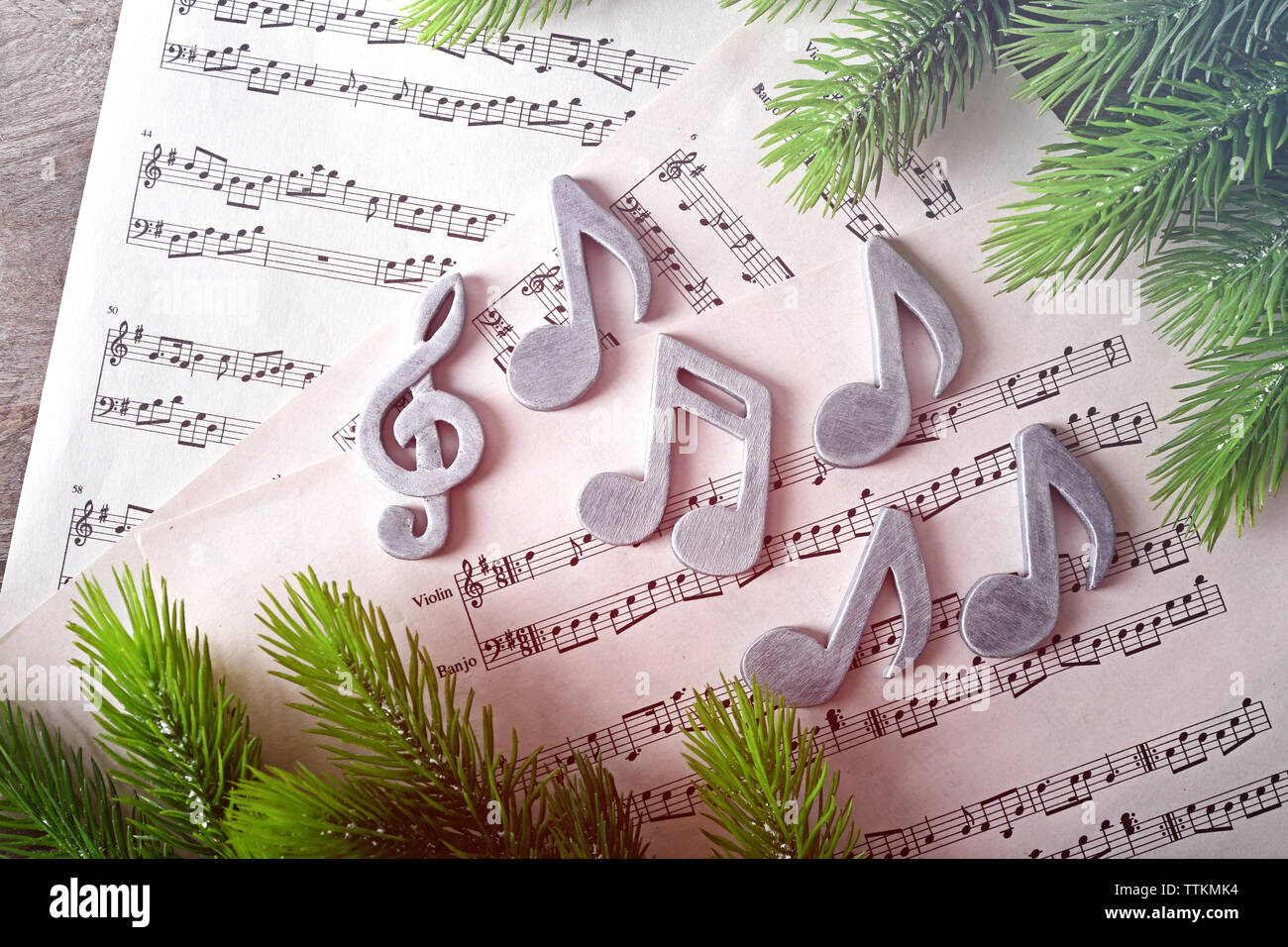 Music notes and Christmas tree on wooden background Stock Photo - Alamy
