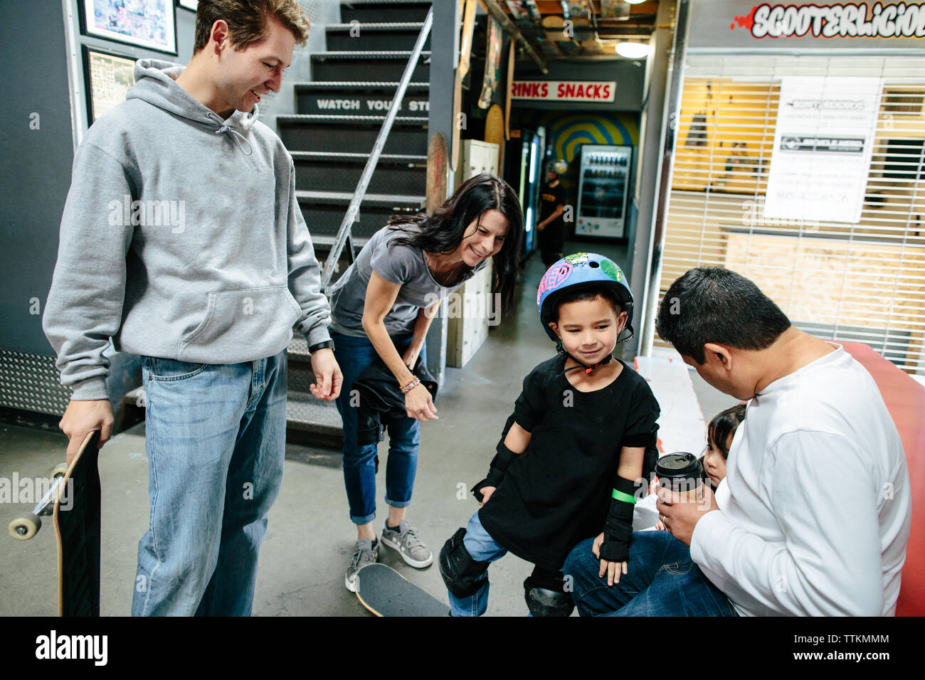 Skateboarding instructor greets his student Stock Photo - Alamy