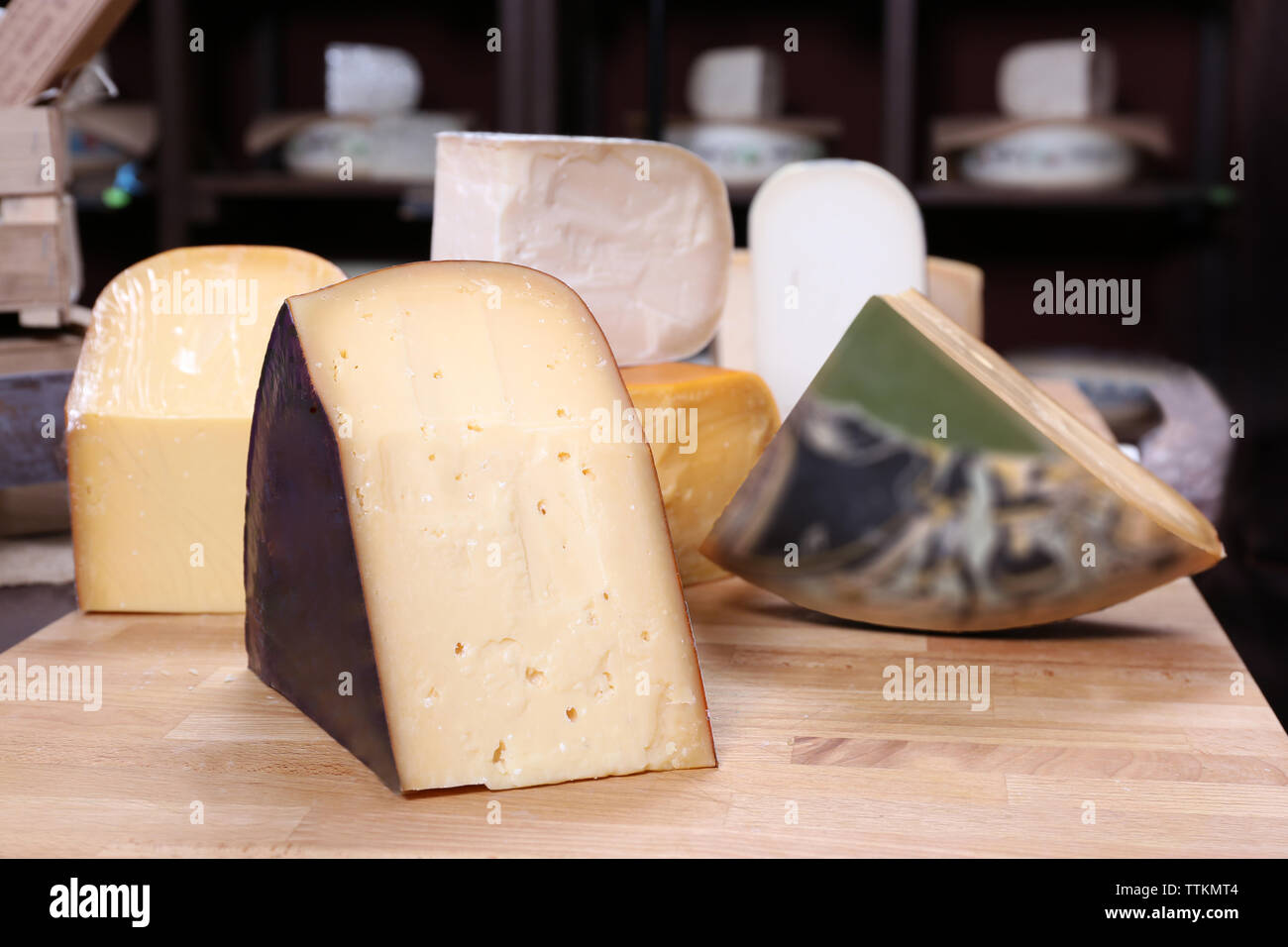 Fresh cheese on the table in cellar Stock Photo - Alamy
