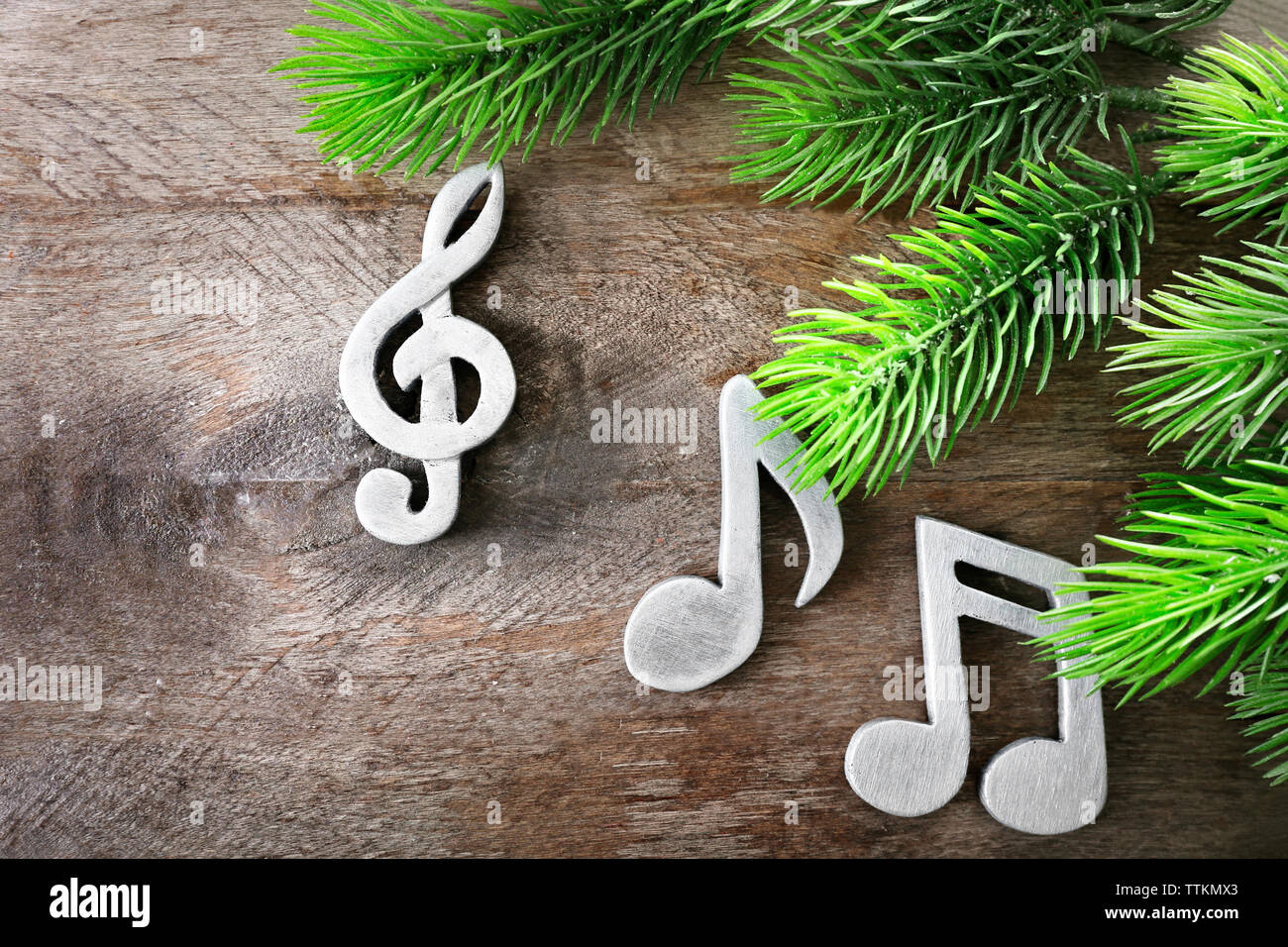 Music notes and Christmas tree on wooden background Stock Photo - Alamy