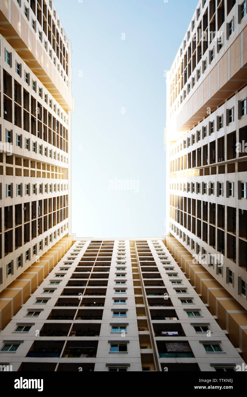 Directly below shot of residential buildings against clear sky Stock ...