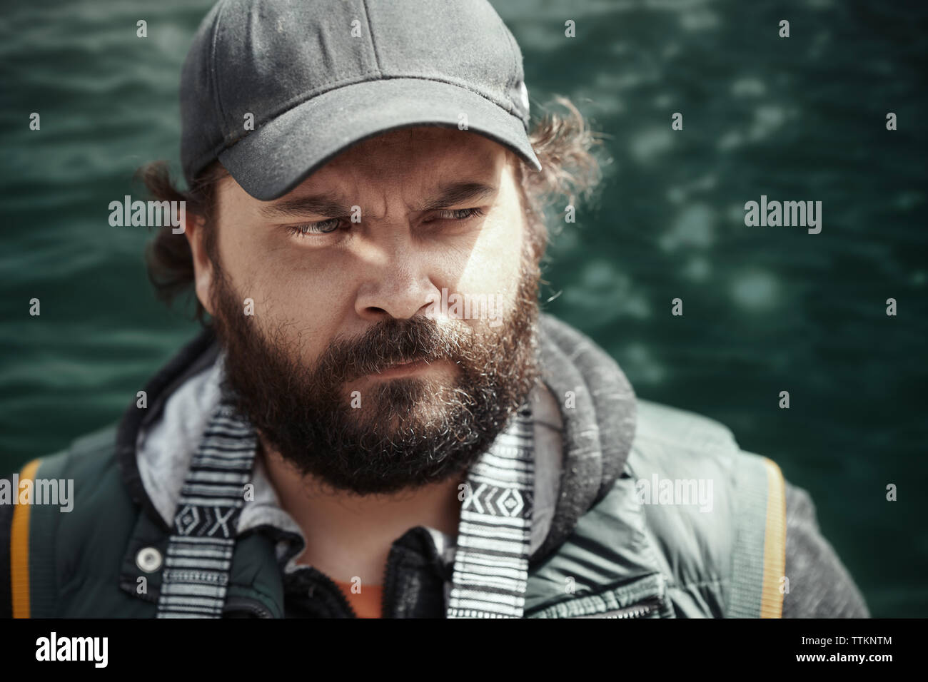 Globe trotting man at the mountain lake Stock Photo - Alamy
