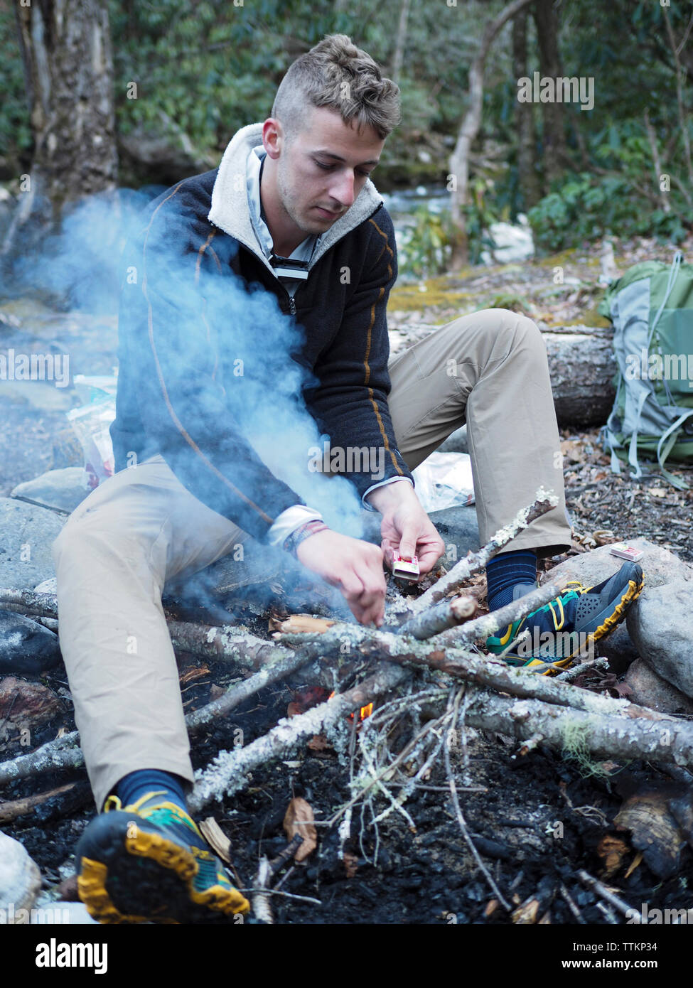 Hiker lighting up campfire at Pisgah National Forest Stock Photo - Alamy