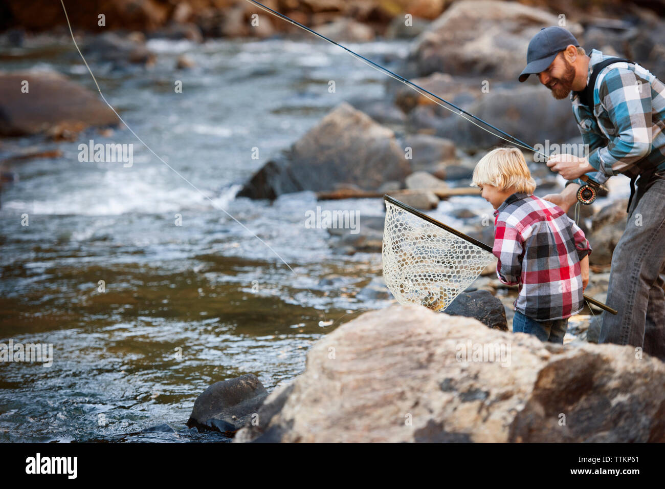 Boy with fishing net hi-res stock photography and images - Alamy