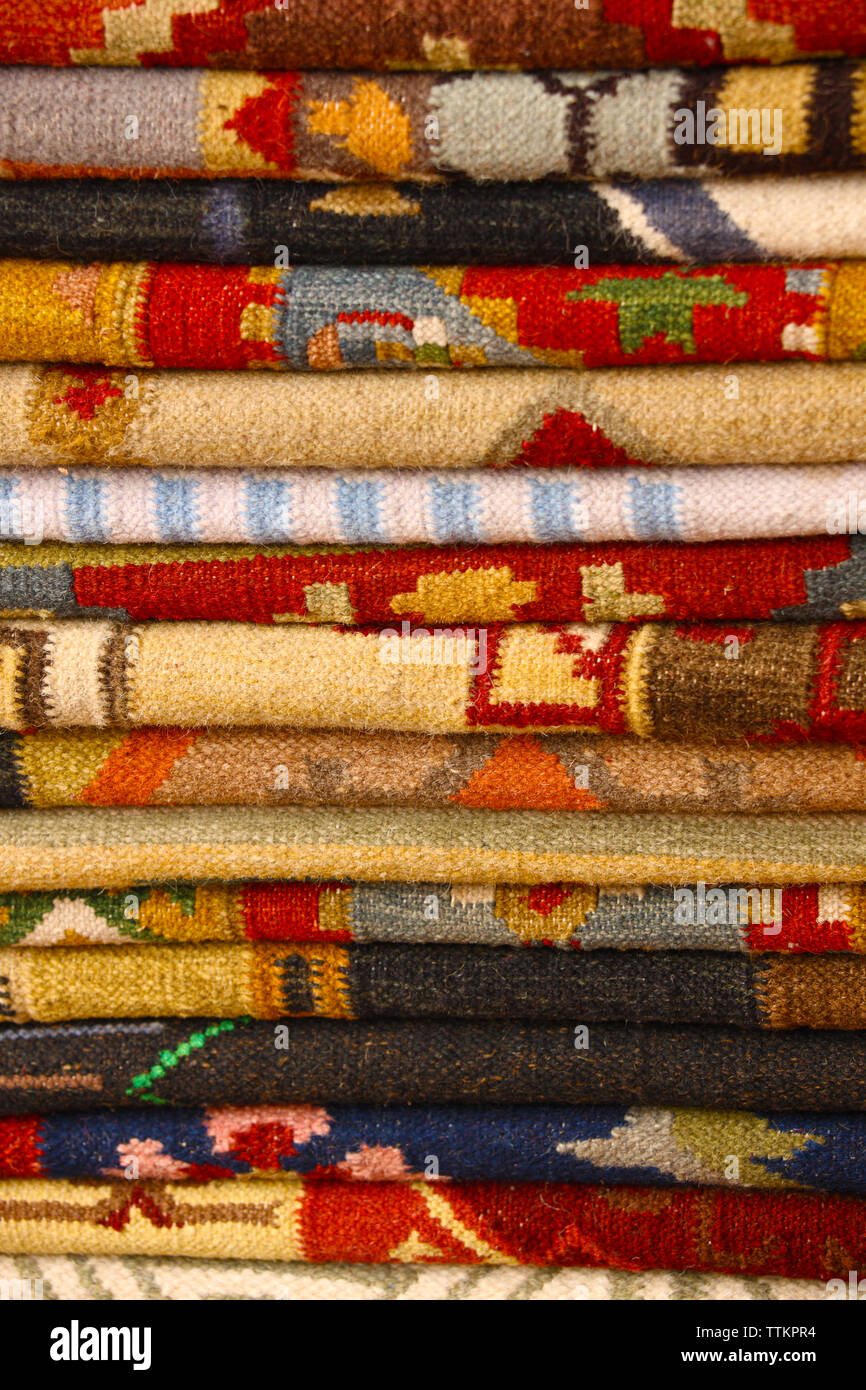 Stack of rugs at a market stall, Dilli Haat, New Delhi, India Stock ...
