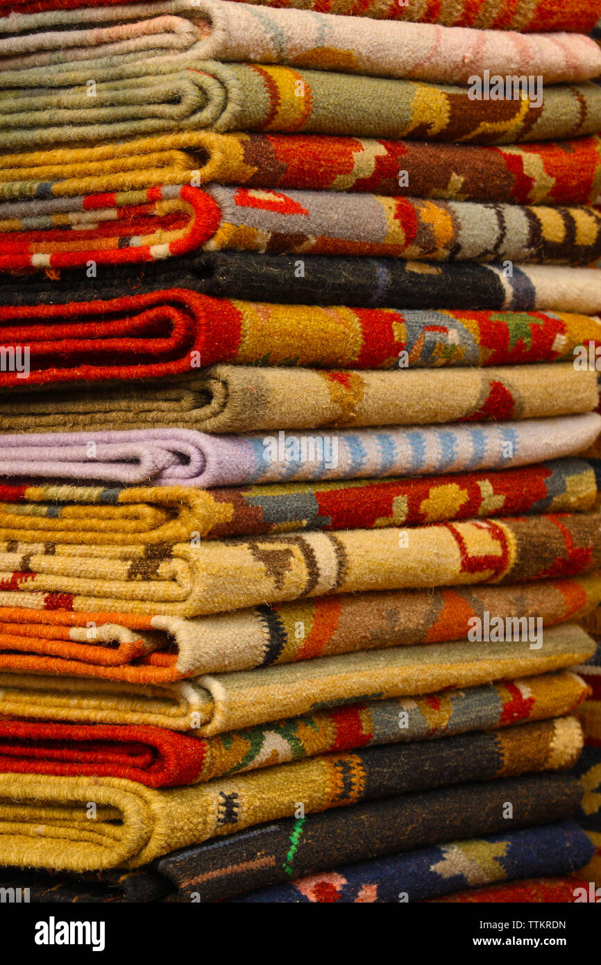 Stack of rugs at a market stall, Dilli Haat, New Delhi, India Stock ...