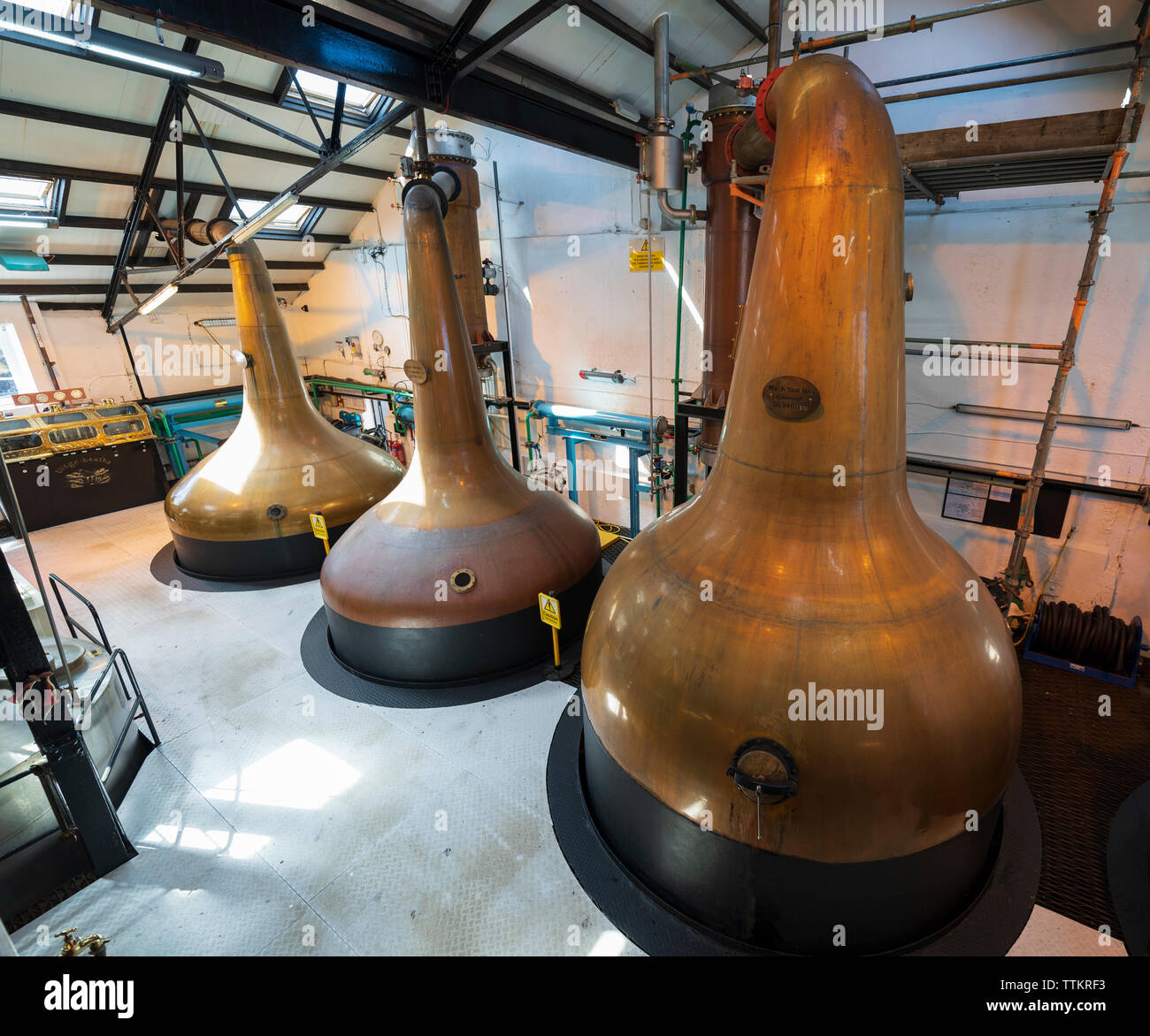 Stills inside still room Room at Bowmore Distillery on island of Islay ...