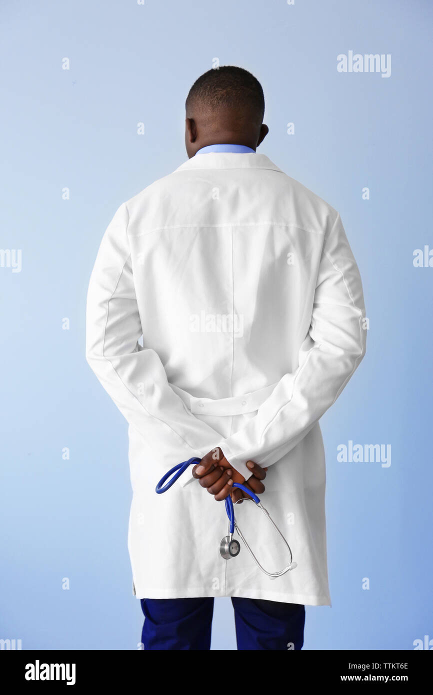 Professional African doctor on light background Stock Photo - Alamy