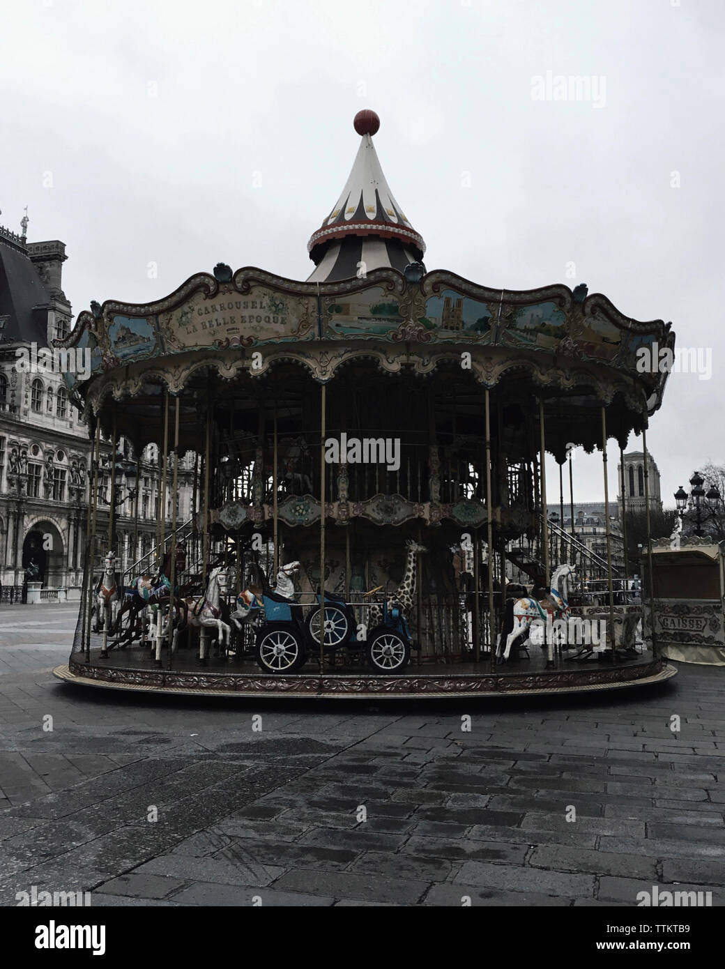 Empty carousel at amusement park against sky in city Stock Photo - Alamy