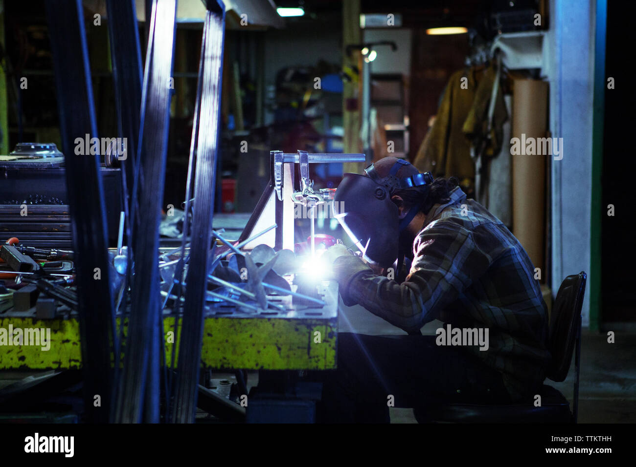 Young man worker examining hi-res stock photography and images - Alamy
