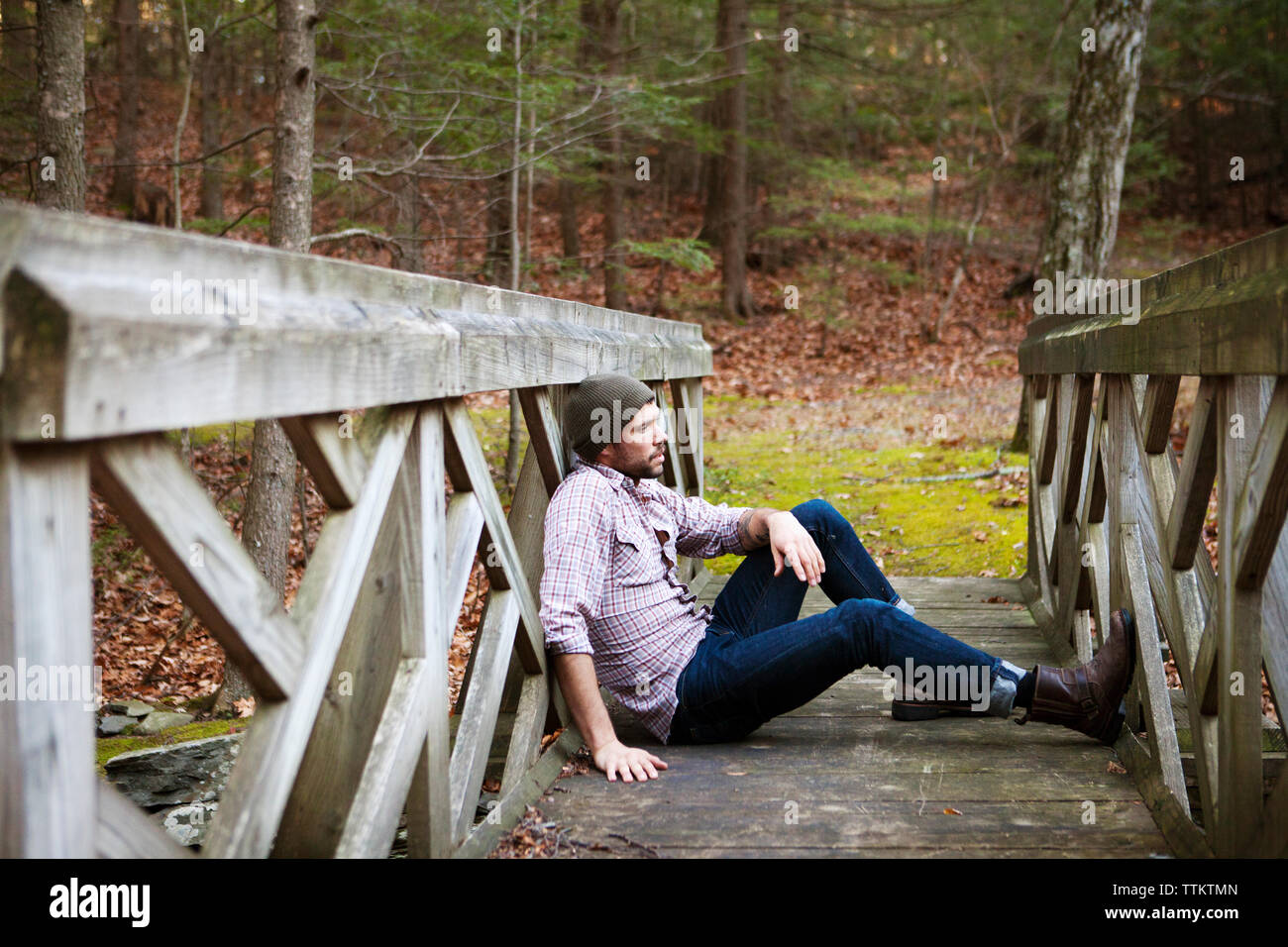 Man sitting on bridge in hi-res stock photography and images - Alamy