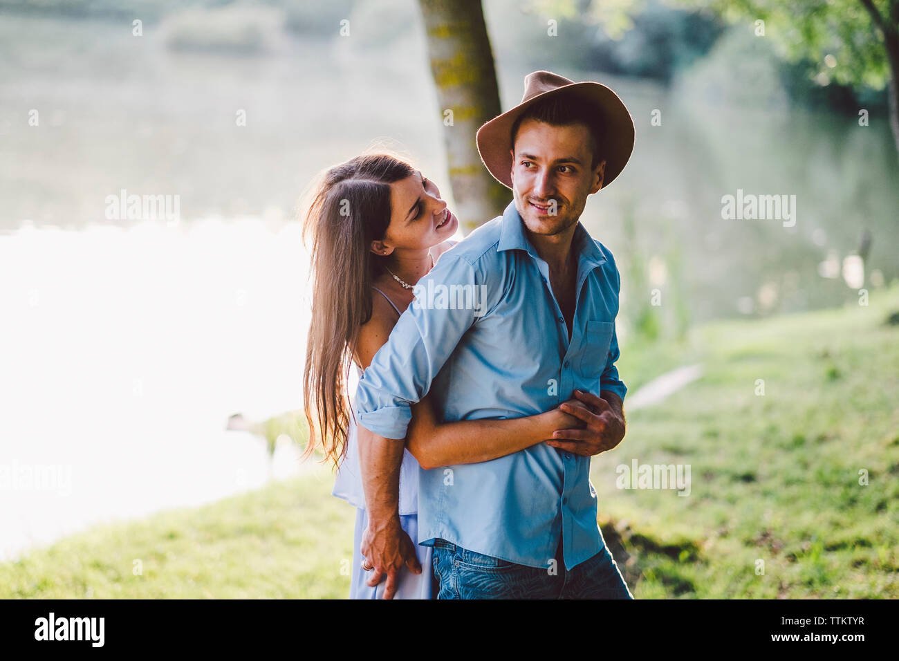 Romantic couple standing park hi-res stock photography and images - Alamy